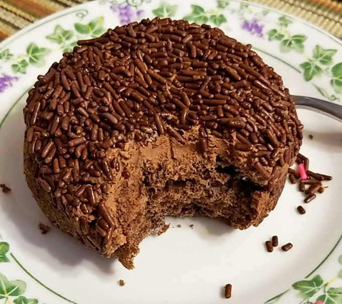 This chocolate-covered beauty has more sprinkles than a Bob Ross painting has happy little trees.