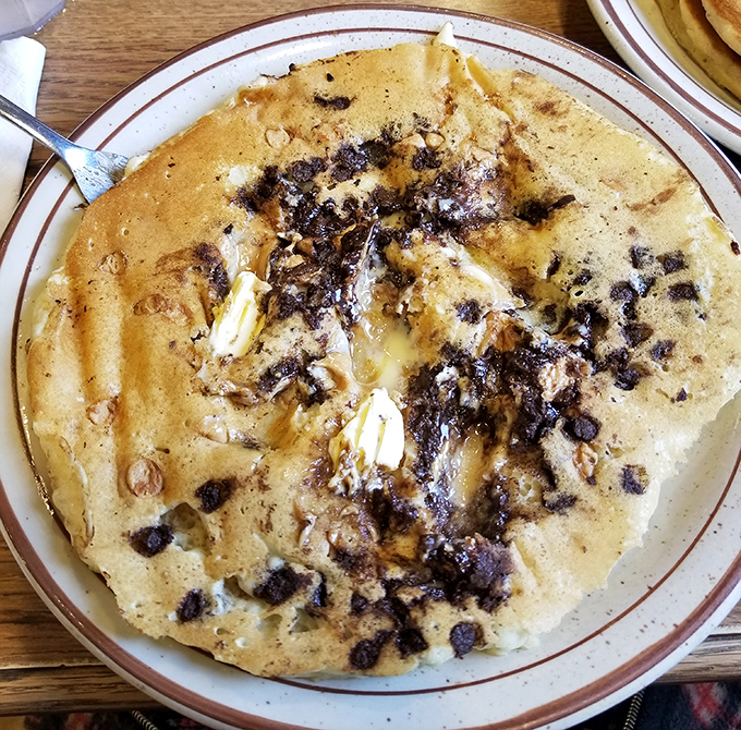 Chocolate chip pancakes that make you question why anyone would eat "regular" pancakes. Butter melting into those chocolate craters? Pure breakfast bliss.