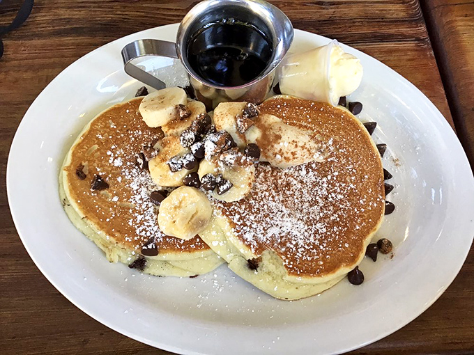 These chocolate chip banana pancakes aren't just breakfast, they're therapy &ndash; fluffy discs of joy dusted with powdered sugar and topped with nature's candy.