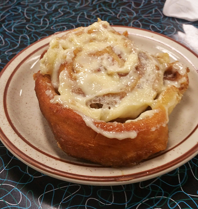 This cinnamon roll isn't just breakfast&mdash;it's dessert masquerading as a morning meal, with melty icing cascading down spirals of cinnamon-sugar perfection.