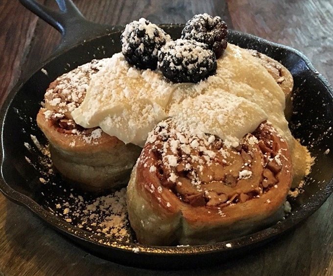 Cinnamon rolls that deserve their own ZIP code &ndash; pillowy spirals crowned with vanilla cream cheese frosting and a scattering of nuts for textural perfection.