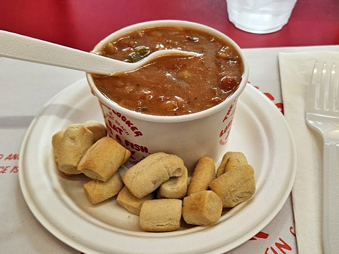 Manhattan clam chowder that demands to be savored, served with pillowy oyster crackers that beg to be dunked into that tomatoey goodness.