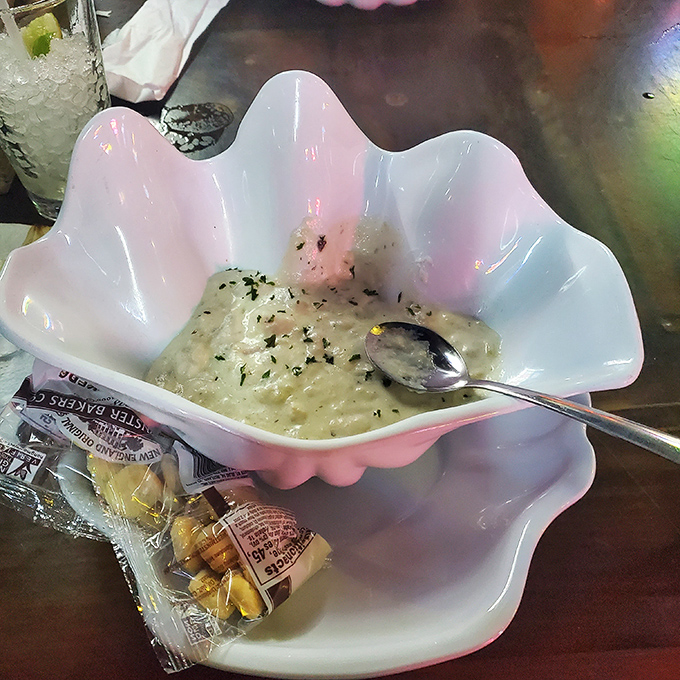 Clam chowder served in a shell-shaped bowl&mdash;because in Florida, even the dishware dresses for the occasion.