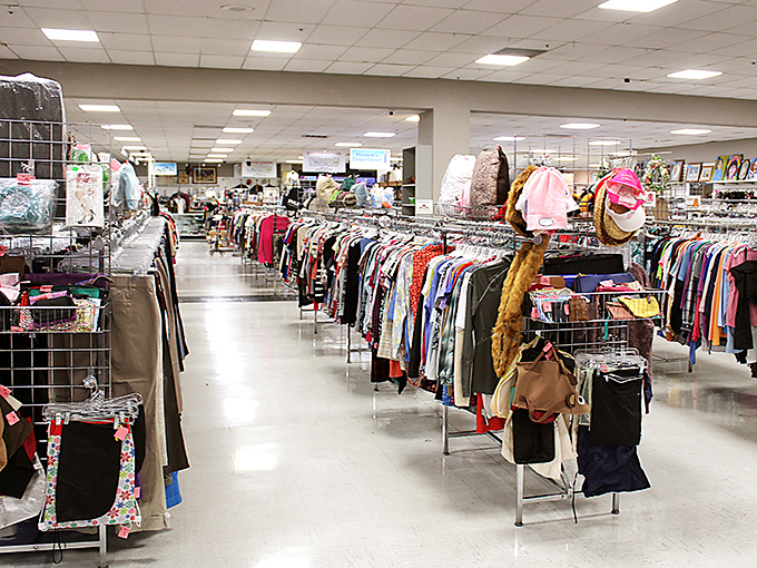 The clothing aisles stretch toward the horizon like a secondhand fashion runway. Each rack holds potential style transformations.