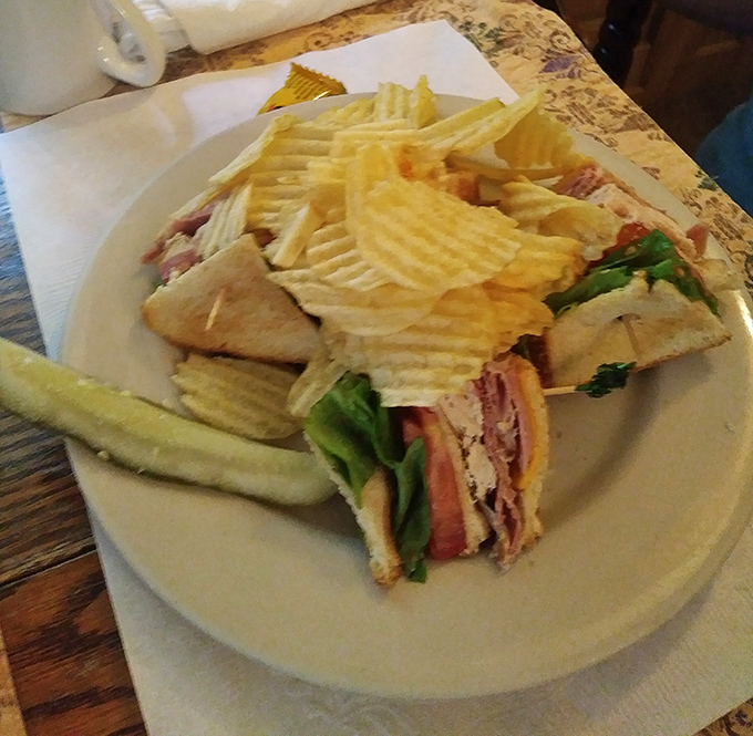 The club sandwich arrives like an architectural marvel&mdash;layers of Virginia ham and fresh vegetables flanked by a guard of perfectly crisp chips.
