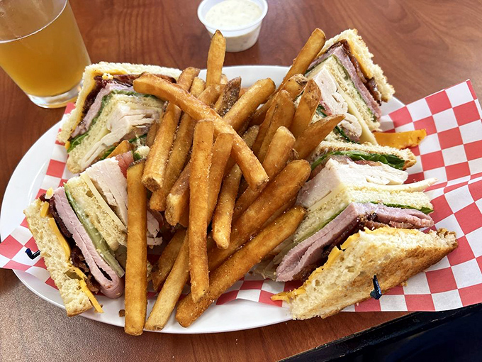The club sandwich&mdash;civilization's perfect portable meal. Three layers of bread creating the high-rise apartment building that delicious ingredients dream of living in.