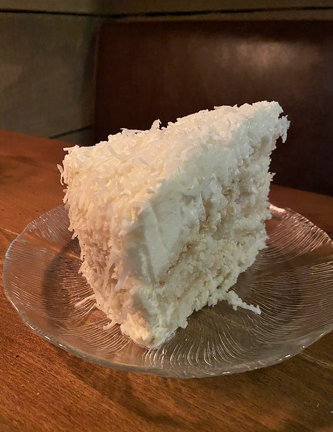 Behold the legendary coconut cake&mdash;a towering achievement of fluff, cream, and coconut that makes grown adults contemplate licking the plate.