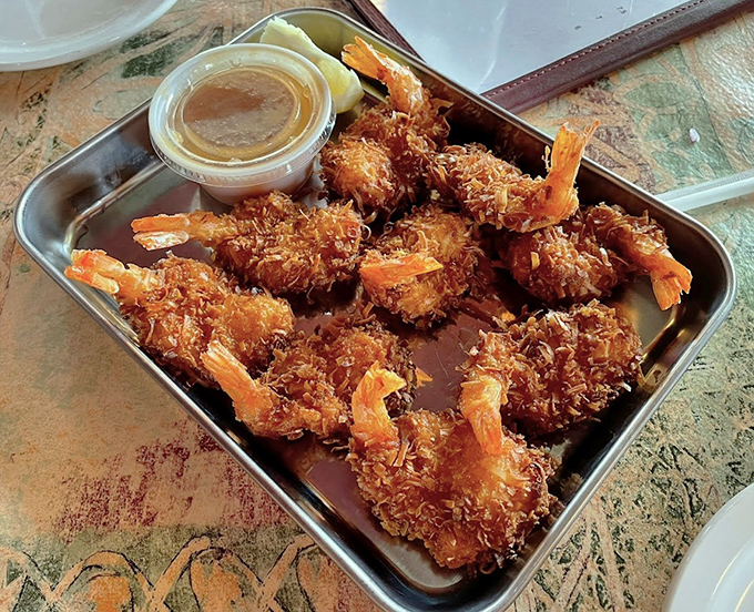Coconut shrimp that crunch like a satisfying walk through autumn leaves. Golden, crispy perfection waiting to be dunked in that sweet dipping sauce.