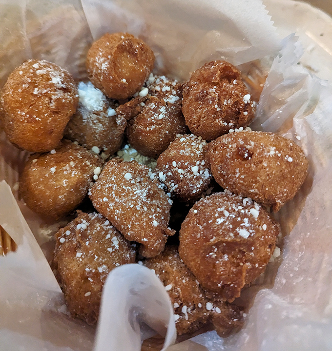 These aren't just hush puppies&mdash;they're little golden orbs of cornmeal bliss dusted with powdered sugar, like donut holes that went to seafood school.