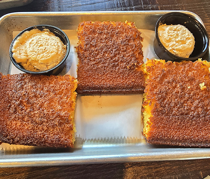 Cornbread so perfectly crusted it should have its own Instagram account. Those dipping sauces aren't just accessories&mdash;they're essential companions on this flavor journey.