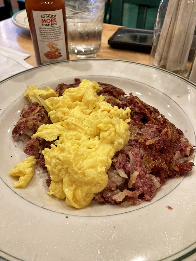 Corned beef hash with eggs that would make your cardiologist wince and your taste buds sing. Worth every delicious, savory bite.