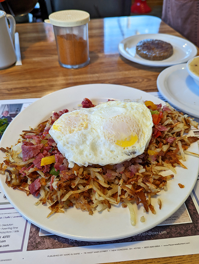 Corned beef hash that puts hotel breakfast buffets to shame, crowned with a perfectly cooked egg that's just waiting for its Instagram moment.
