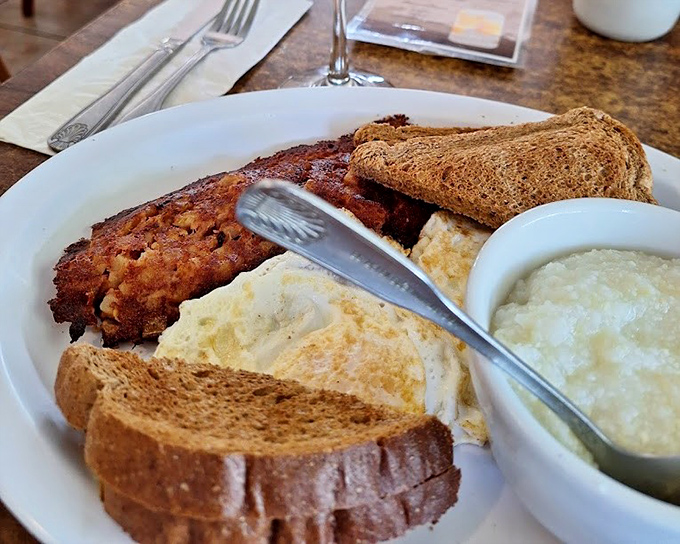 Breakfast perfection on a plate: crispy corned beef hash, eggs your way, and toast ready to soak up every last bit of yolk-meets-gravy goodness.