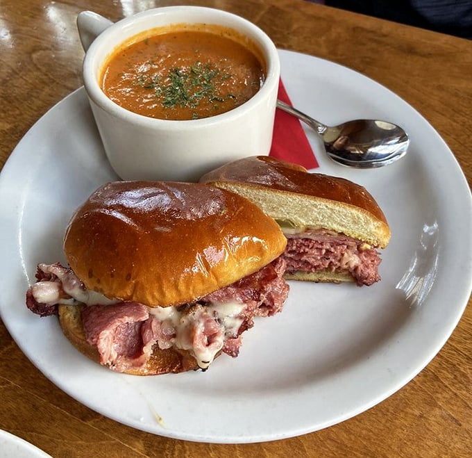 This isn't just a sandwich; it's corned beef architecture with a side of tomato bisque that might make you forget about the snow outside.