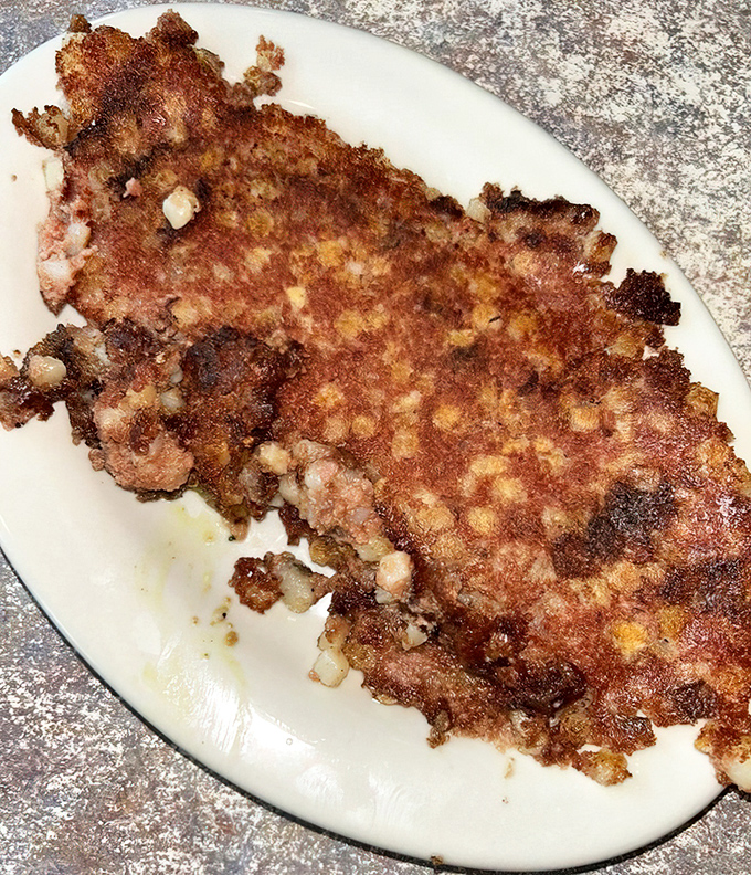 This isn't just corned beef hash; it's a crispy, golden-brown masterpiece that makes you wonder why you'd ever order anything else.
