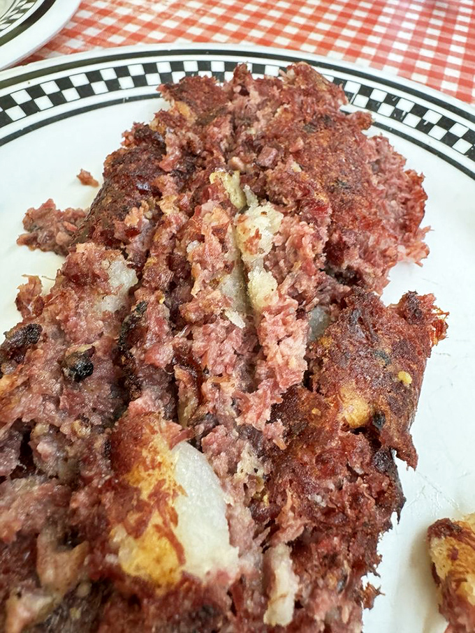 This isn't just corned beef hash; it's a crispy-edged masterpiece that would make your grandmother both jealous and proud.