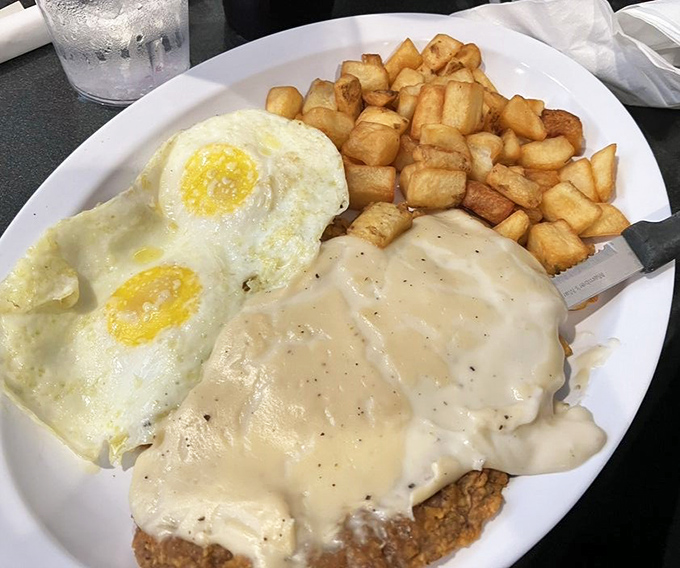 Country fried steak that could make a vegetarian reconsider life choices. Those golden potatoes and creamy gravy are the supporting actors in this breakfast drama.
