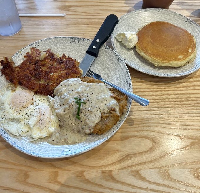 Country fried steak with eggs and gravy&mdash;the breakfast equivalent of a warm Southern hug that says, "Bless your heart, you needed this."