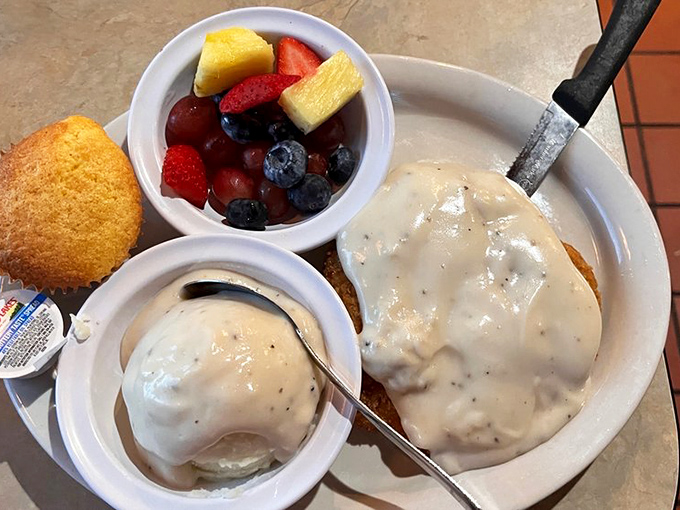 Fresh fruit and country-style biscuits and gravy&mdash;a breakfast that says, "Go ahead, take that nap later. You've earned it."
