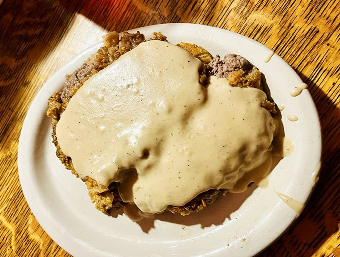 Country fried steak swimming in gravy so good you'll contemplate drinking it. Grandma would approve, cardiologist maybe not so much.