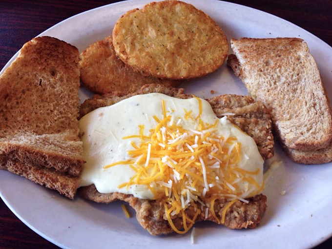 Country fried steak crowned with creamy gravy and melted cheese &ndash; the kind of hearty plate that renders dinner completely unnecessary.