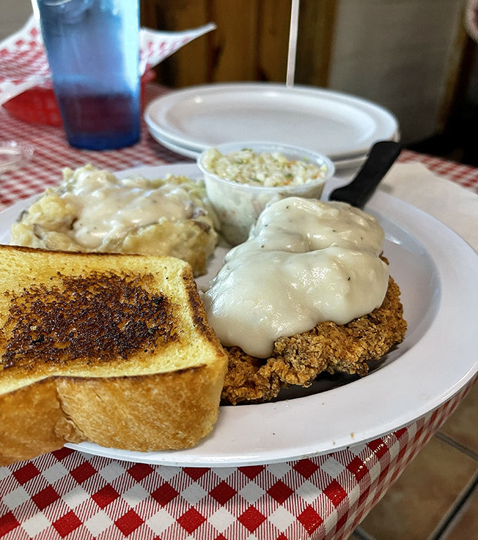 Country fried steak so tender it practically cuts itself, smothered in gravy that could make a vegetarian reconsider life choices.