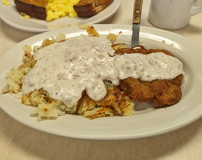 Country fried steak smothered in pepper gravy&mdash;comfort food that hugs your insides. The kind of breakfast that fuels both body and soul for whatever the day brings.