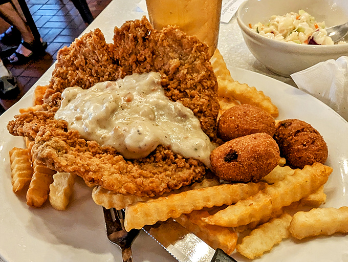 Country fried steak with gravy so good you'll want to write home about it, if you weren't too busy cleaning your plate.