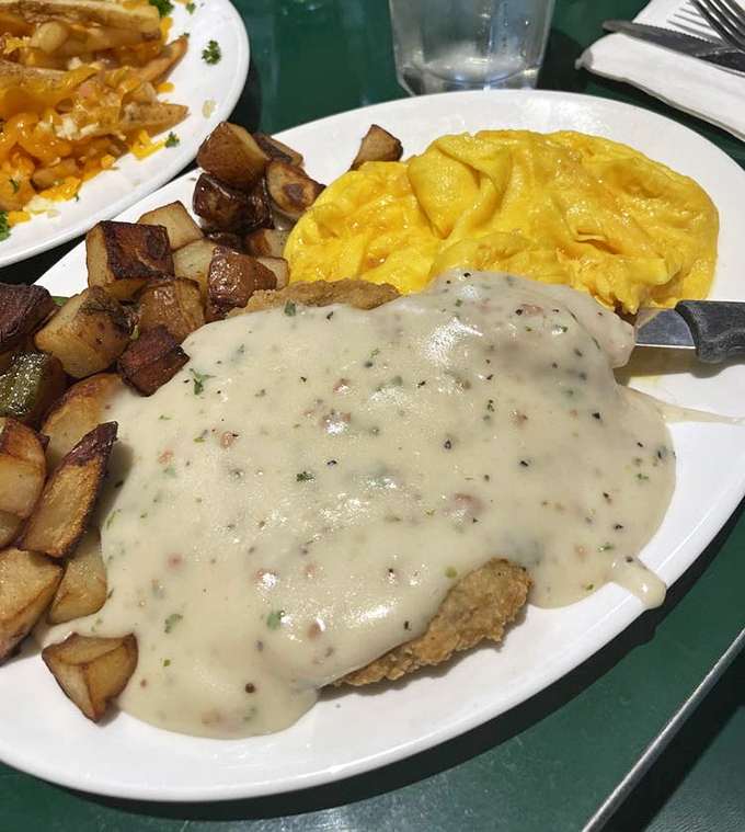 Country fried steak smothered in pepper gravy with those home-style potatoes&mdash;comfort food that makes you want to hug your plate before devouring it.