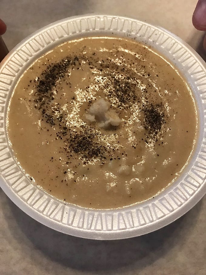 A proper crab bisque should make you forget your troubles. This one, with its perfect pepper sprinkle, looks like it could solve international conflicts.