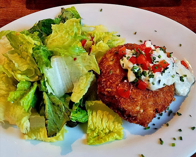 The Maryland-style crab cake doesn't hide behind fillers&mdash;it proudly showcases sweet lump crabmeat topped with fresh pico and a dollop of heaven.