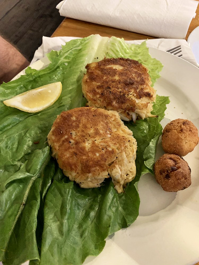 Golden perfection meets oceanic bliss in what might be Virginia's most underrated crab cake masterpiece.