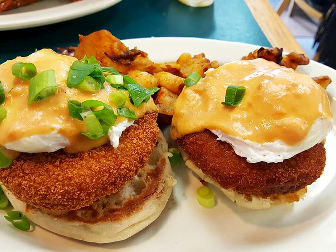 Behold the star attraction: golden-brown crab cakes crowned with poached eggs and hollandaise, a Benedict that would make the Pope himself convert to breakfast worship.