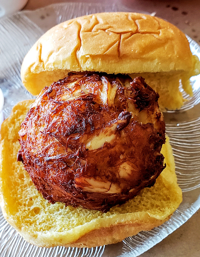 The perfect crab cake sandwich doesn't exi&mdash; Oh wait, here it is! Golden-brown perfection that's mostly crab and just enough binding to keep it together.