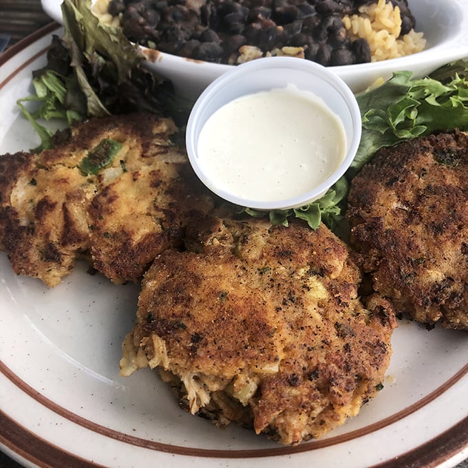 Crab cakes that actually deserve the name&mdash;mostly crab, barely bound, perfectly bronzed. The kind that make you wonder why you ever settled for less.