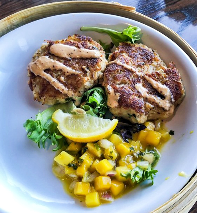 These crab cakes look like they graduated summa cum laude from seafood university, dressed to impress.