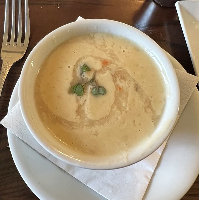The award-winning she-crab soup arrives like a silky, oceanic embrace in a bowl. One spoonful and you'll understand why it's legendary.