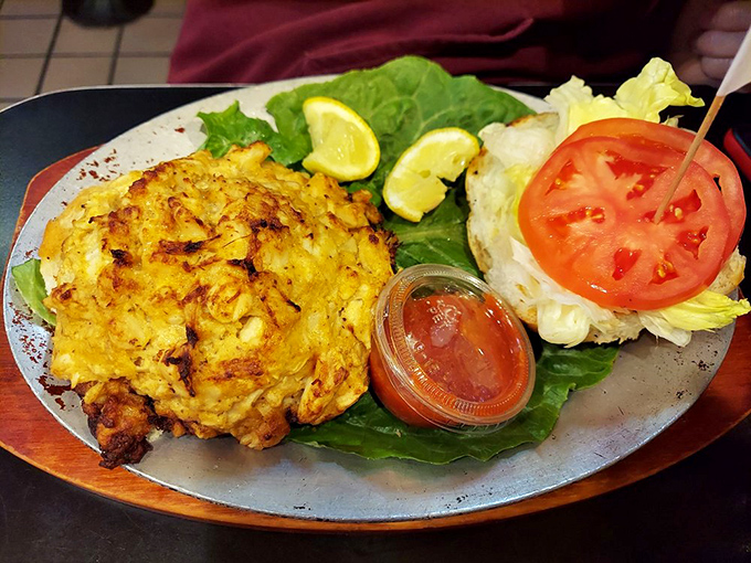 Maryland's state treasure on a plate: a golden-brown crab cake that's more crab than cake, served with a side of local pride.