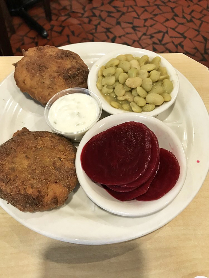Crab cakes and sides that would make a Marylander nod in respect. The lima beans and pickled beets offer the perfect counterpoint to the seafood's richness.