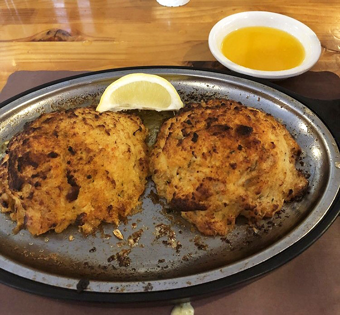 These golden crab cakes aren't just cooked—they're bronzed like Olympic medals for seafood excellence.