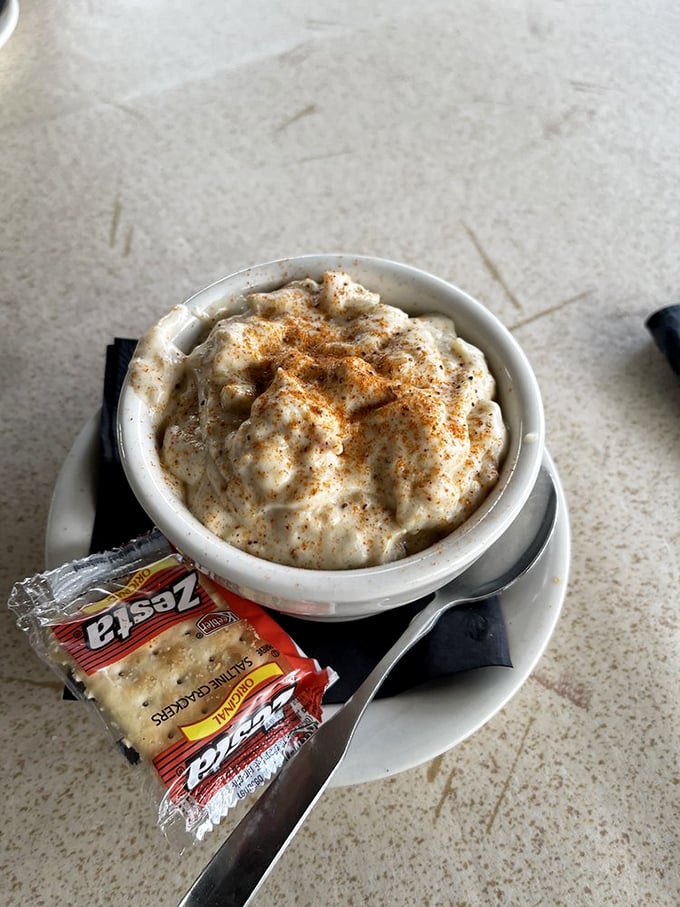 Cream of crab soup so rich it should come with its own investment portfolio, topped with a sprinkle of Old Bay that whispers "Maryland."