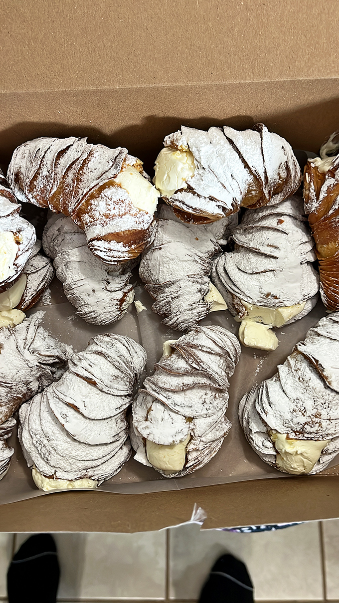 Sfogliatelle so flaky they create their own weather system. These cream-filled Italian pastries are worth every buttery, powdered-sugar-dusted calorie.