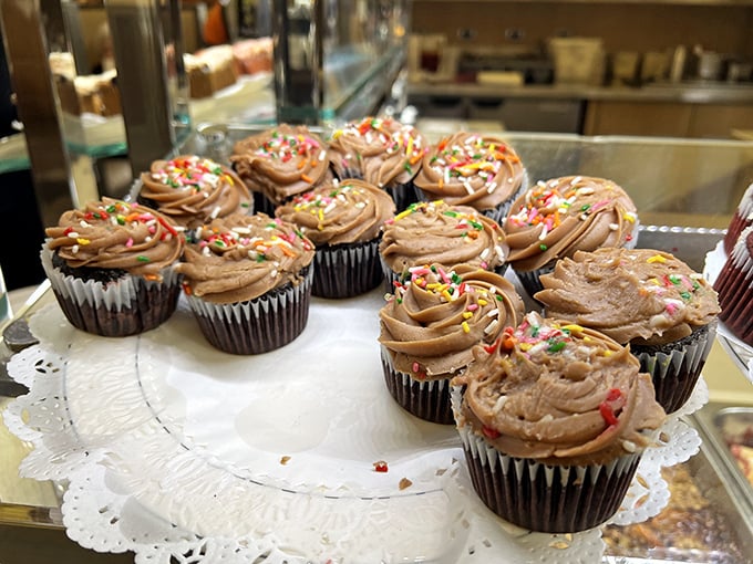 Chocolate cupcakes with sprinkles &ndash; proof that sometimes happiness is simple math: sugar + more sugar = pure joy.