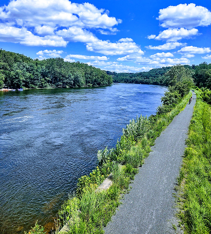 The Delaware River flows like liquid serenity, creating the perfect backdrop for riverside relaxation.