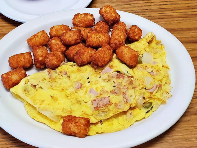 This omelet-hash brown combo isn't just breakfast, it's edible therapy &ndash; golden potatoes crisped to perfection alongside eggs that practically glow with goodness.
