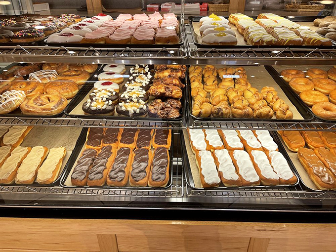 Fresh donuts lined up like sweet soldiers ready to brighten your morning routine.