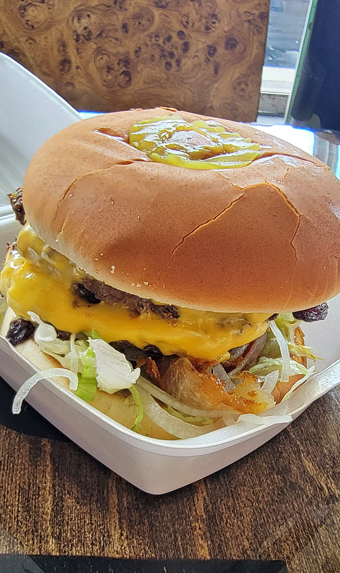 Cheese dripping down the sides of this burger like sunshine melting over the horizon. Pure poetry between buns.