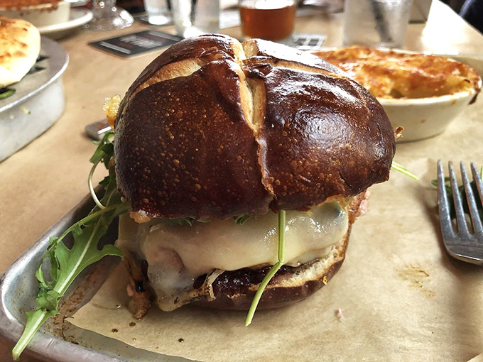 Not your average burger relationship&mdash;this one's built to last. A pretzel bun cradles melted cheese and arugula in a sandwich that demands both hands and your full attention.