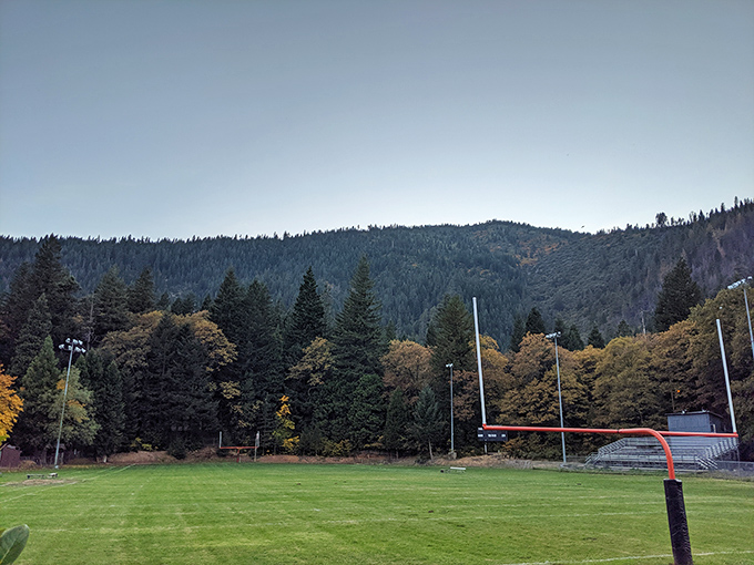 The local football field sits nestled against a backdrop of pine-covered mountains. Friday night lights with a view that puts NFL stadiums to shame.