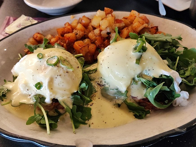 Eggs Benedict reimagined with perfectly poached eggs and potatoes that have clearly found their life's purpose.